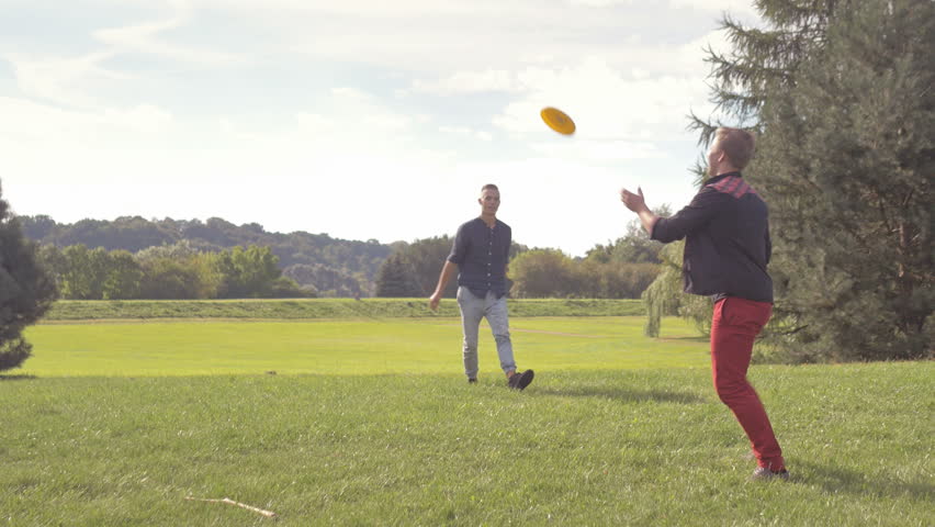 Several Young People Playing Frisbee Stock Footage Video (100% Royalty ...