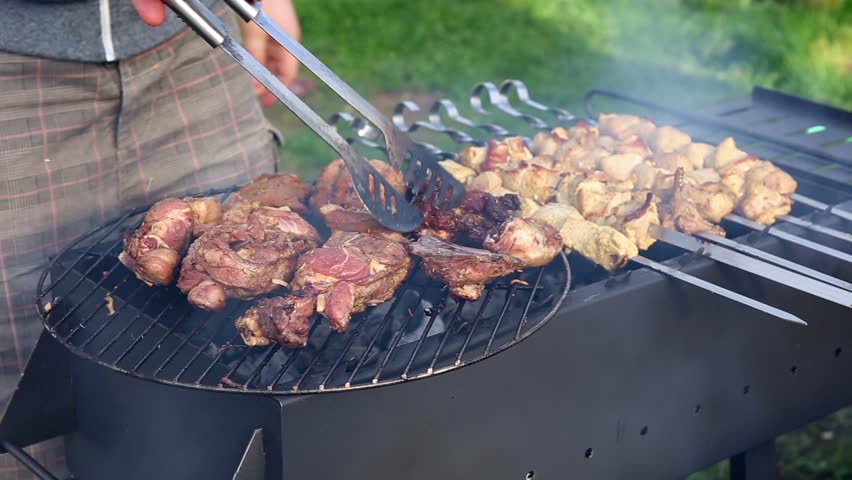 Beef And Beef Steak,sausage And Chicken Leg On Swaying Schwenker Grill ...