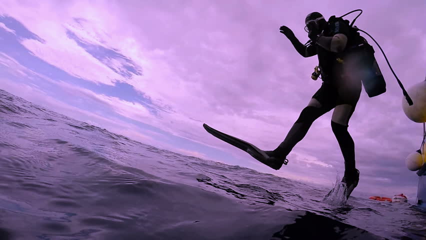 Stock Video Clip of Scuba Diver Jumping into the Ocean. In slow ...