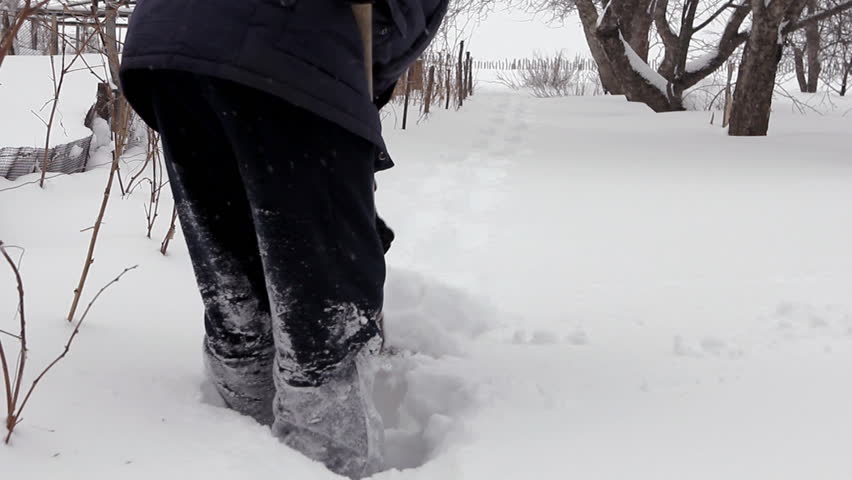 Stock video of man clearing deep snow off with | 1056052 | Shutterstock