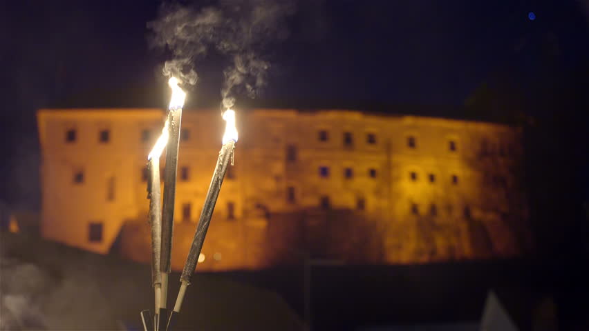 Stock Video Clip of Night static shot of three burning torches ...