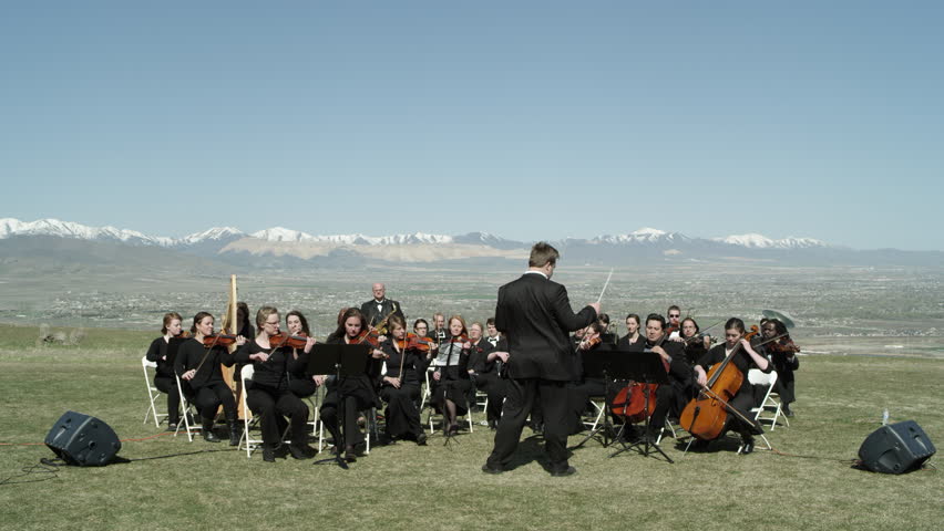 Shot Of Outdoor Orchestra, Close Up On The Musicians Playing String ...