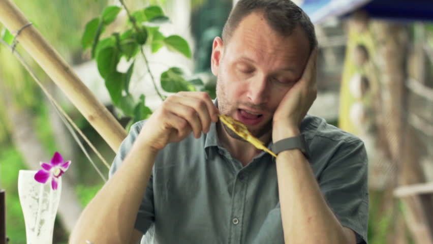 Stock video of sad, unhappy man eating meal in | 10937672 | Shutterstock