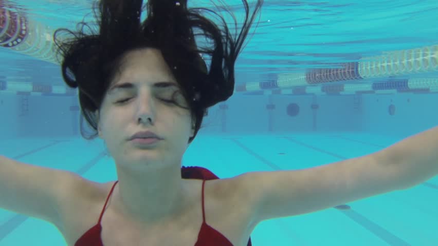 SLOW MOTION: Woman Wearing Red Dress Having Fun Inside Swimming Pool ...