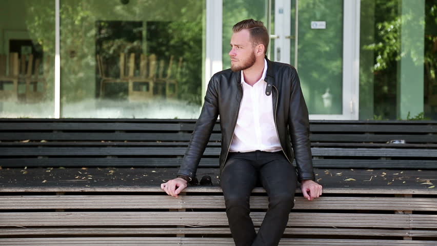 A Man 29 Years Old Sitting Down Outside On A Bench, Wearing A White ...