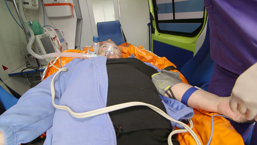 EMT Provide Emergency Medical Care For Critical Senior Patient In ...