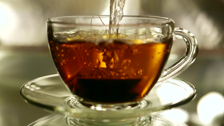 Black Tea In A Bag Brewed With Boiling Hot Water In Cup And Saucer ...