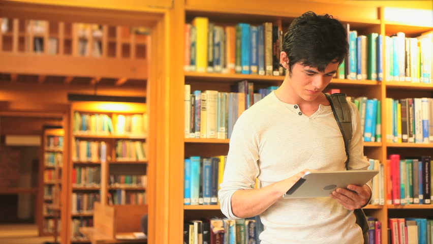 Handsome Man Reading A Book In A Library Stock Footage Video 1335586 ...