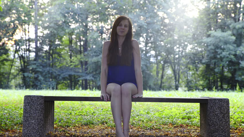 Stock video of pretty girl on bench smiling 4k. | 13436672 | Shutterstock