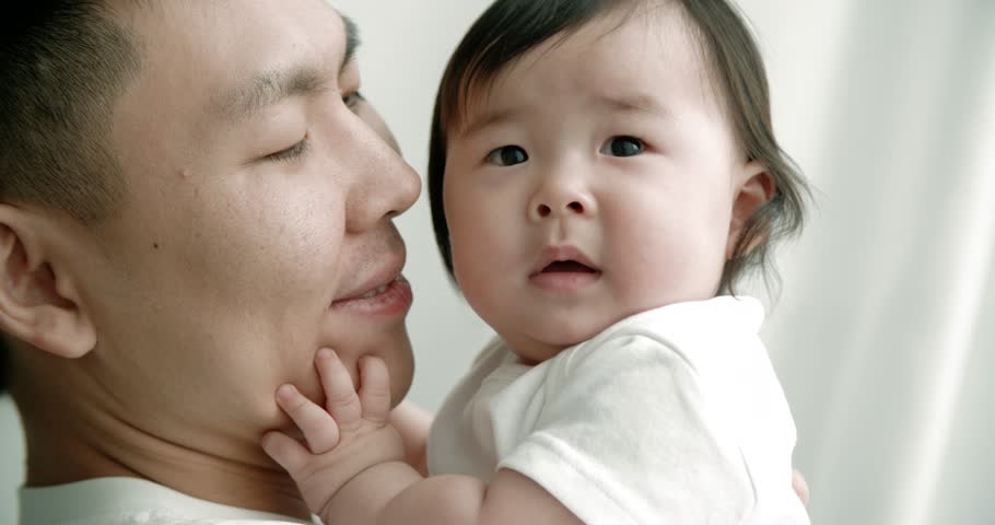 Young Asian Father Lovingly Holding Stock Footage Video (100% Royalty ...