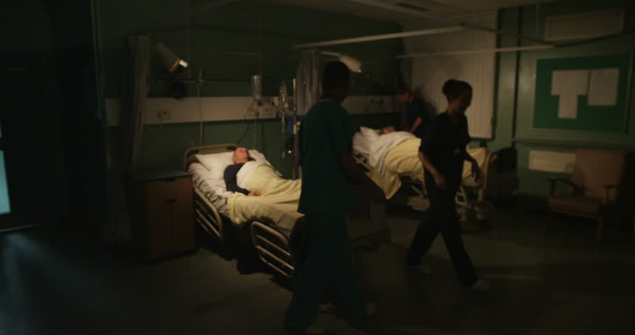 Nurses On A Hospital Ward Are Taking Care Of Their Patients At Night. A ...