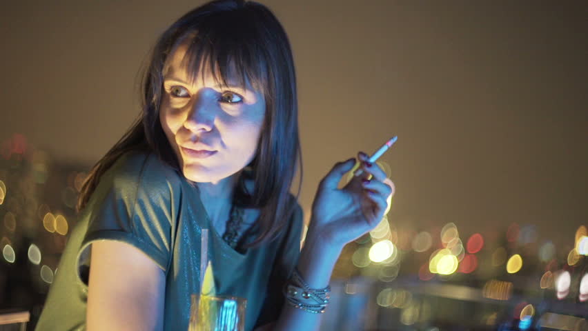 Slow Motion Shot Of Women Smoking Cigarettes At Night / Nice, France ...