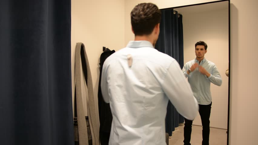 Young, Pretty Woman Checking Her Face And Neck In Mirror In Bathroom ...