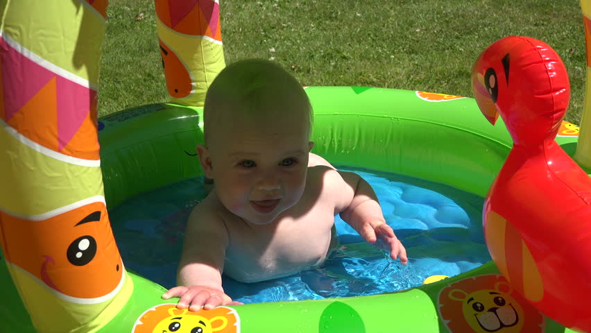 Stock video of cute baby girl enjoy kiddie pool | 14999362 | Shutterstock