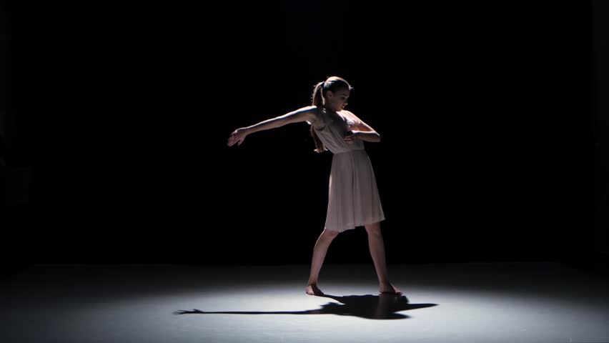 Young Woman Dancer Dancing Contemporary Dance And Doing A Split, On ...