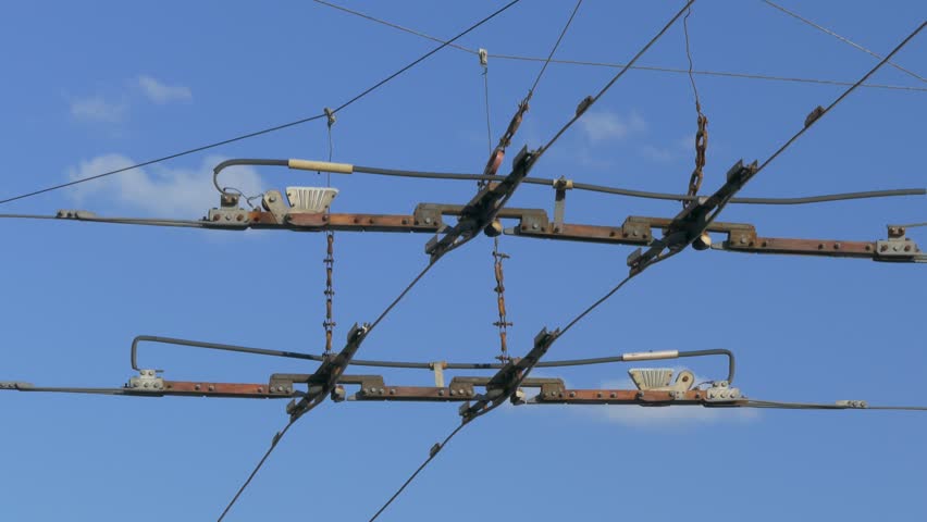 ELI5: How do the trolley poles of trams/streetcars and trolley buses ...