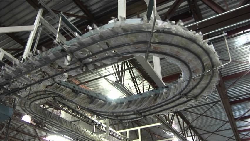Stock Video Clip of Newspapers flow along an assembly line in ...