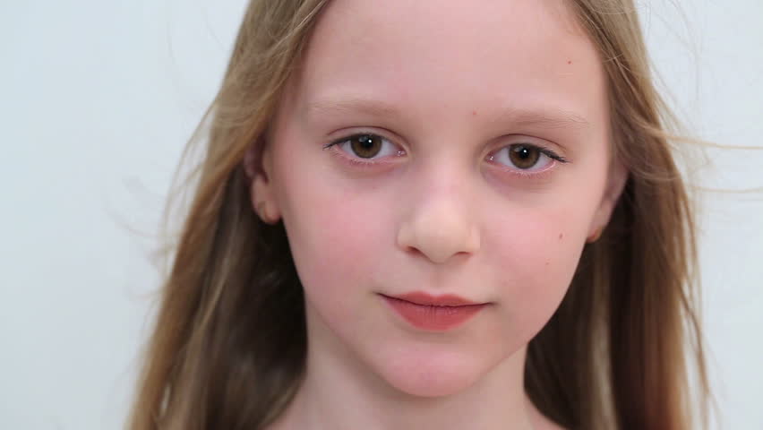 Close-up Portrait Of 7 Year Old Girl Turning Around And Looking At ...