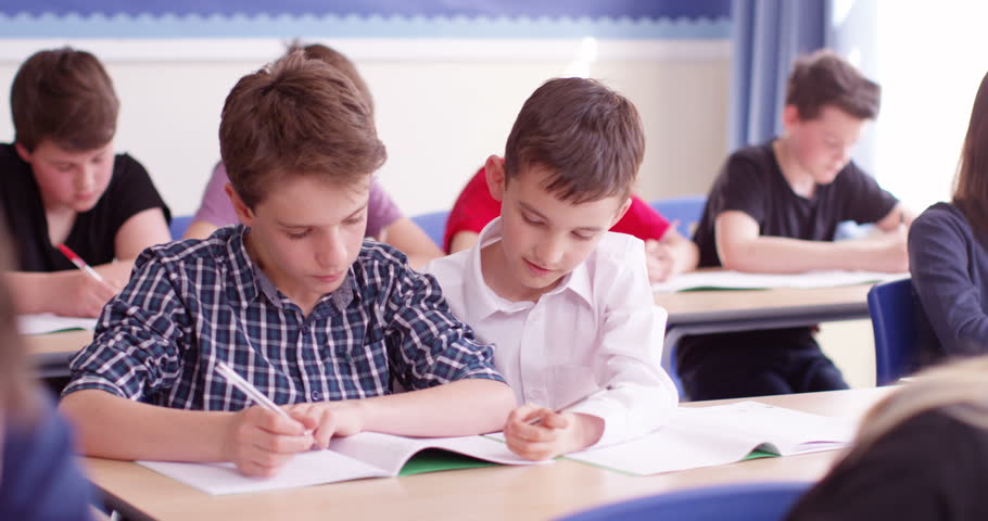 4k, Two Boys In A School Classroom Studying Together. Stock Footage ...