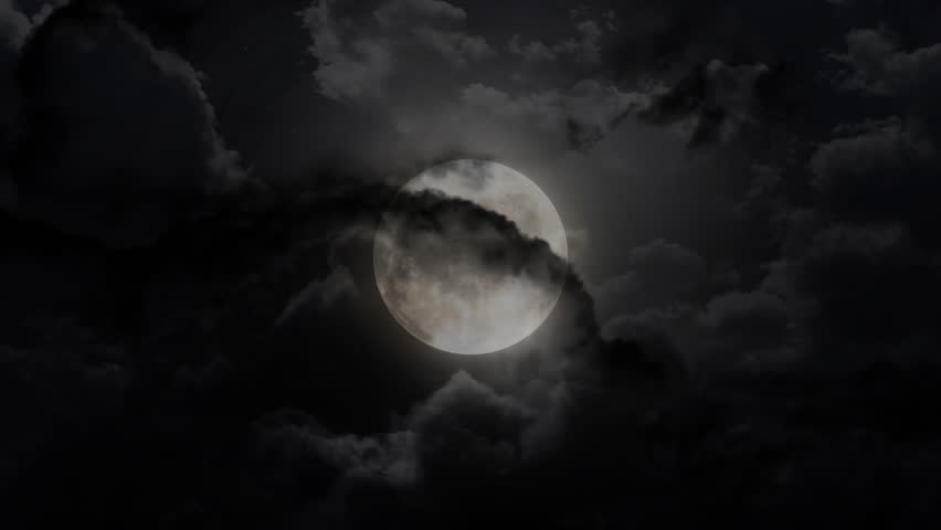 Dark Night Sky With A Full Moon Shining Bright As Clouds Move Across The Face Of The Moon ...