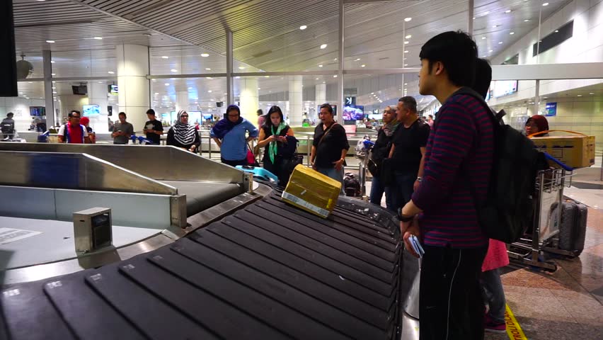 DENPASAR, INDONESIA - APRIL 2016 : Passengers At Baggage Reclaim In ...