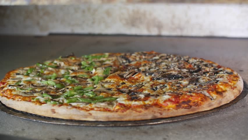 Slow Motion Close-up Of Drooping Slice Of Pepperoni Pizza Cooked In ...