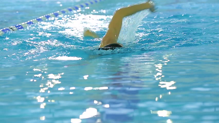 Woman In Blue Bathing Suit Swimming Underwater In Slow Motion Stock ...