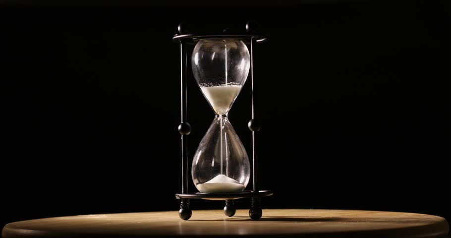 Isolated Hourglass. Hourglass With White Sand. Black Stock Footage ...
