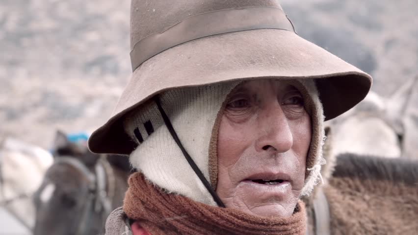 Native Quechua Man Using A Chullo And A Highlander Hat On The Mountains ...