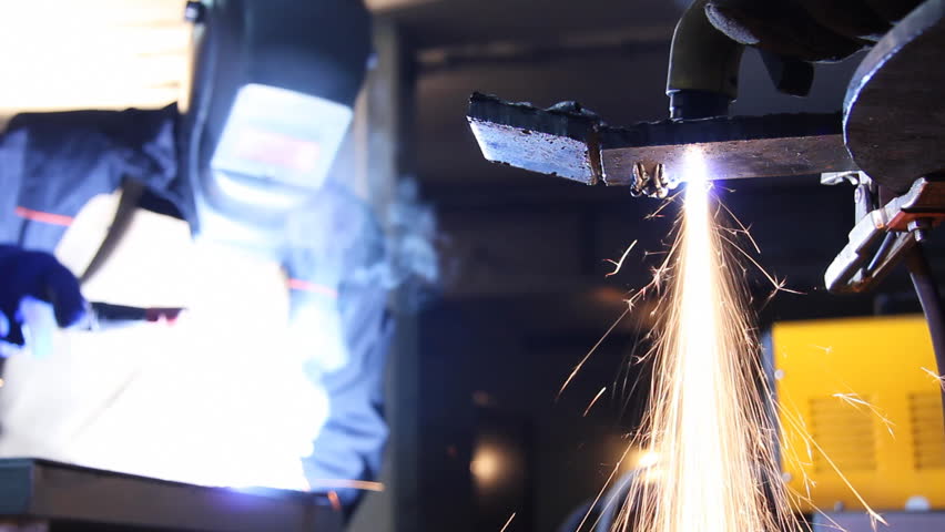 Stock Video Clip of Steel Workers welding, grinding, cutting in metal ...