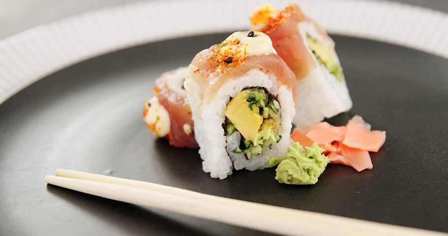 Sliced Sushi Roll On Plate In Japanese Restaurant. Shot On RED Cinema ...