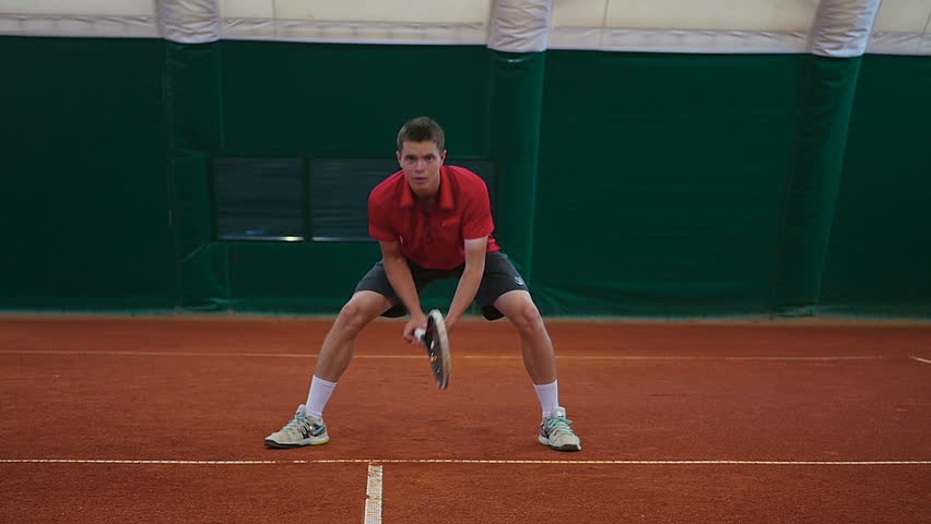 A Experienced Tennis Player Serving To A Beginner Tennis Player. - Slow ...
