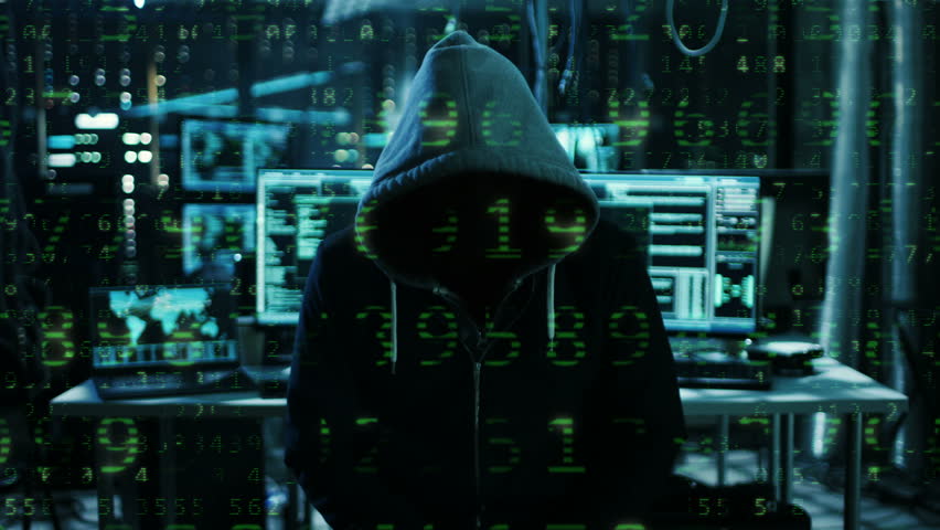 Close-up Mid Shot Of A Hacker Wearing Hoodie Sitting At His Desktop ...