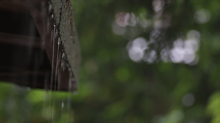 Rain Drops Falling From Roof's Eave During Rain Storm In Portland, Slow ...
