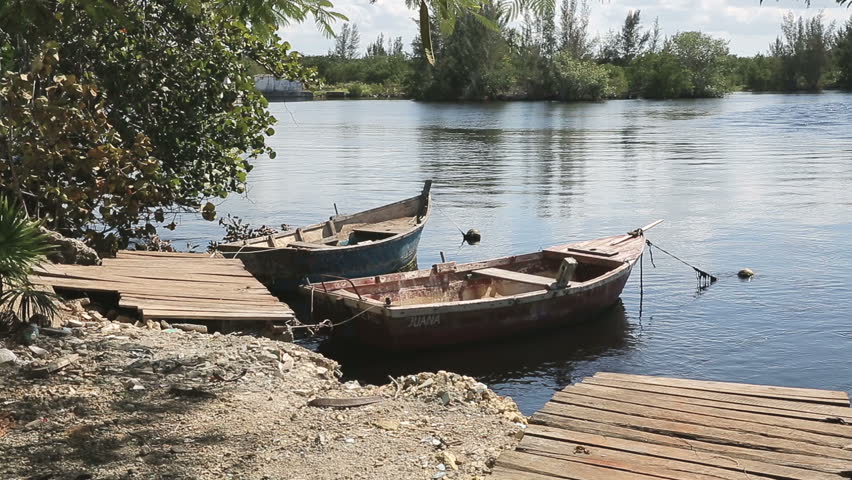 A Logging Boom Boat Is Moored Alongside A Fast Moving River/Boom Boat/A ...