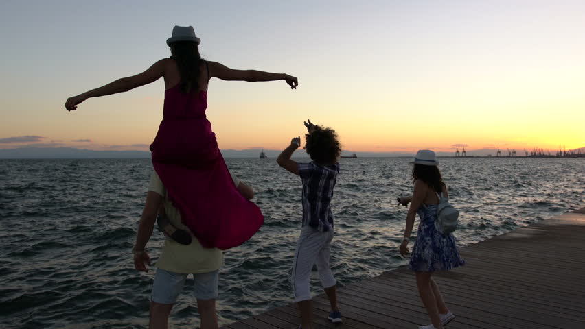 Stock Video Clip of 4K Friends have fun chasing each other | Shutterstock