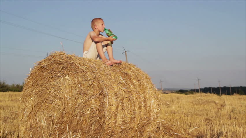 Stock video of boy drinks water in the haystacks | 28903282 | Shutterstock