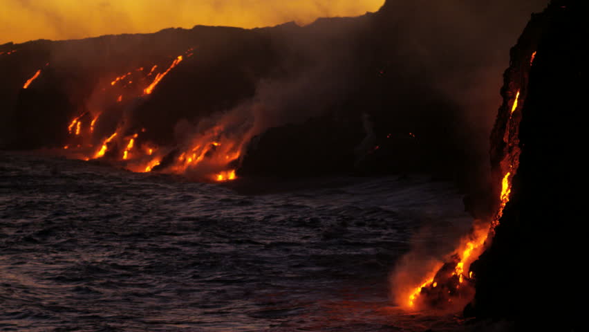 Red Hot Lava Falling Over Barren Volcanic Cliffs Into Ocean Causing ...