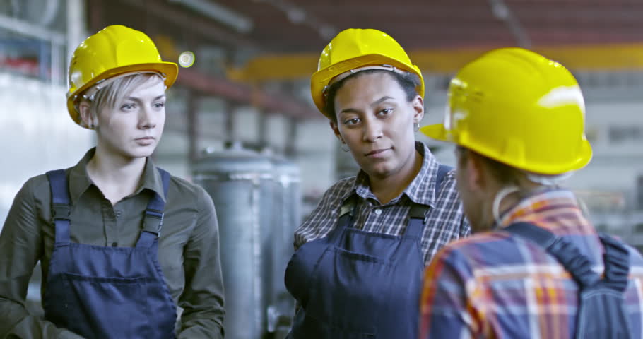 Tracking Slowmo Of Young Female Factory Technician In Hardhat Working ...