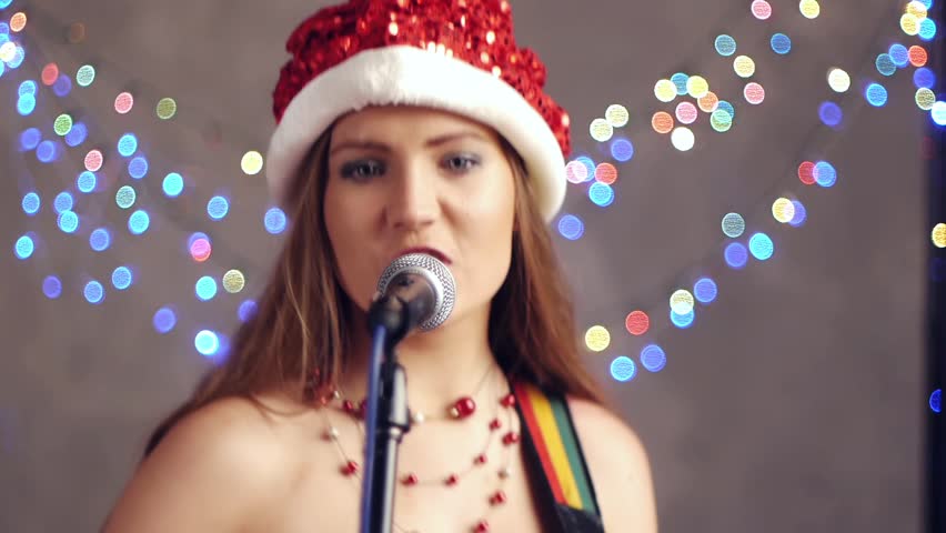 Stock video of beautiful woman in santa claus singing | 2952892 ...