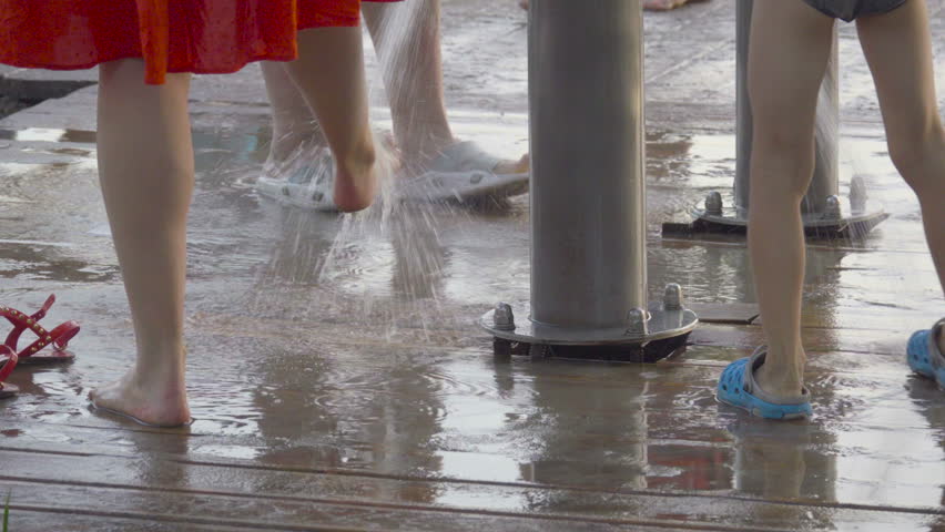 Young Woman Washing Her Legs In Shower On The Beach. Outdoors, Close Up ...