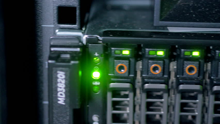 Green LED Lights On Multiple Hard Drives Of A Large Server Blink On And ...