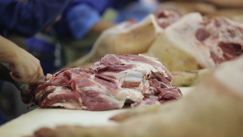 Butcher Cutting Pork Meat In Factory. Fresh Raw Pork Chops In Meat ...
