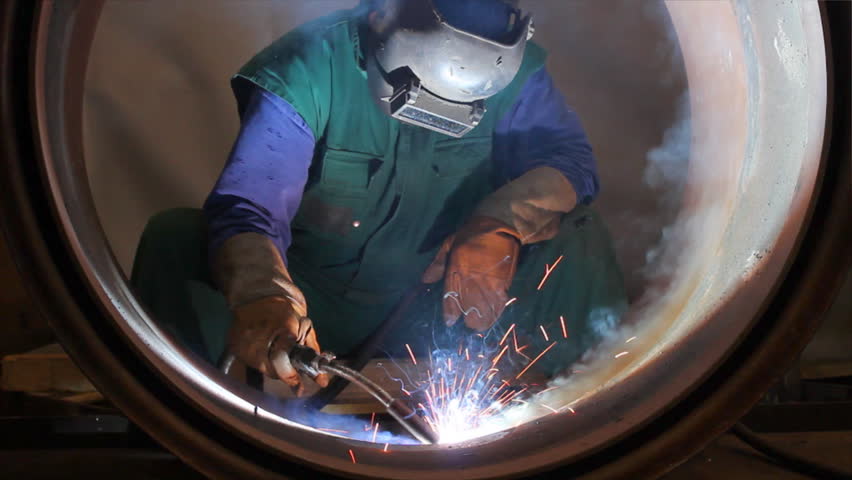 Welder Inside Pipe, Welding The Seam To Create One Continuous Section ...