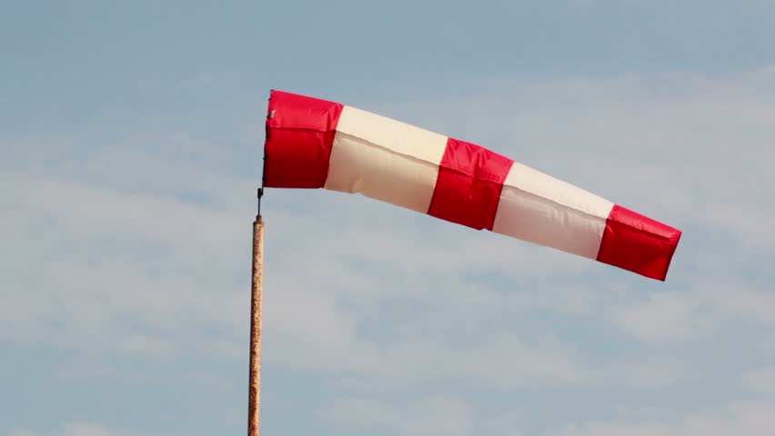 Windsock Indicating Strong Winds.White Clouds In The Background Of Wind ...
