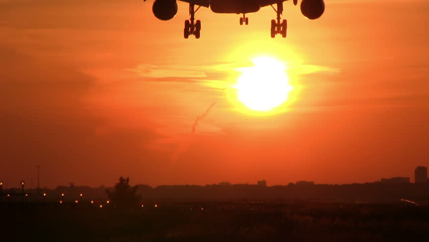 Stock video of huge jet crossing sun at sunset | 3800252 | Shutterstock