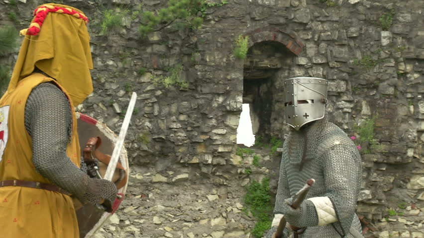 Medieval Knight In Armor, And With An Open Visor Exercise With A Sword ...