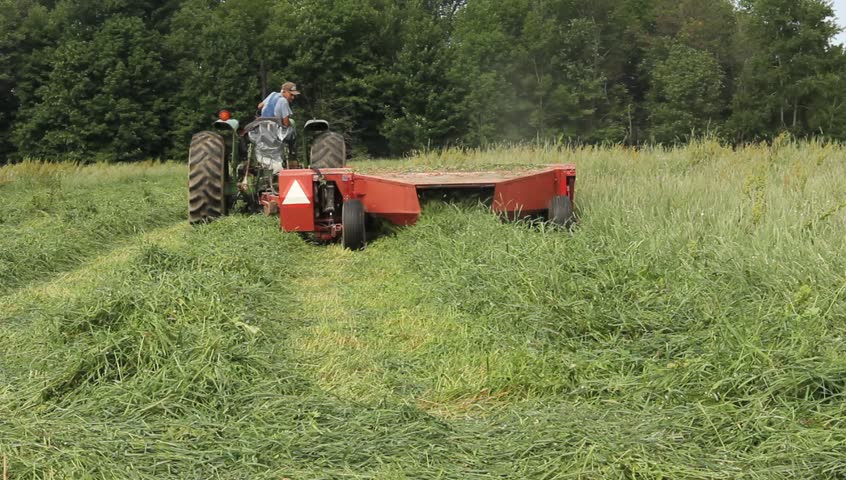 Stock video of farmer cutting a hay field | 4179632 | Shutterstock