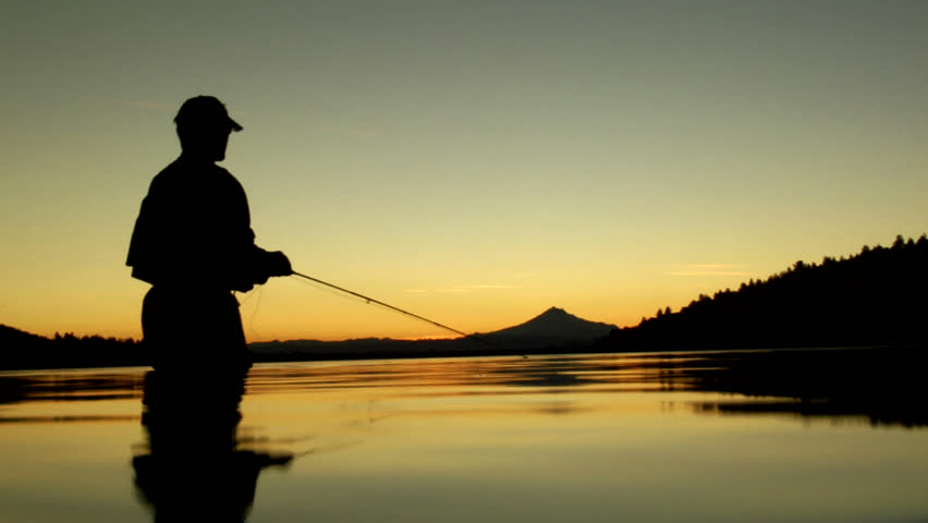 Stock video of fly-fishing at sunset. low angle on | 4553732 | Shutterstock