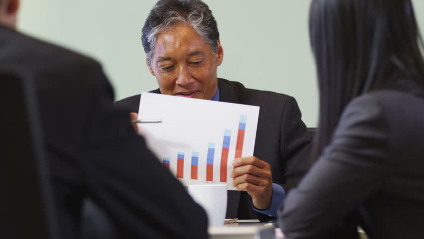 Stock video of senior asian business executive talks at | 4584752 ...